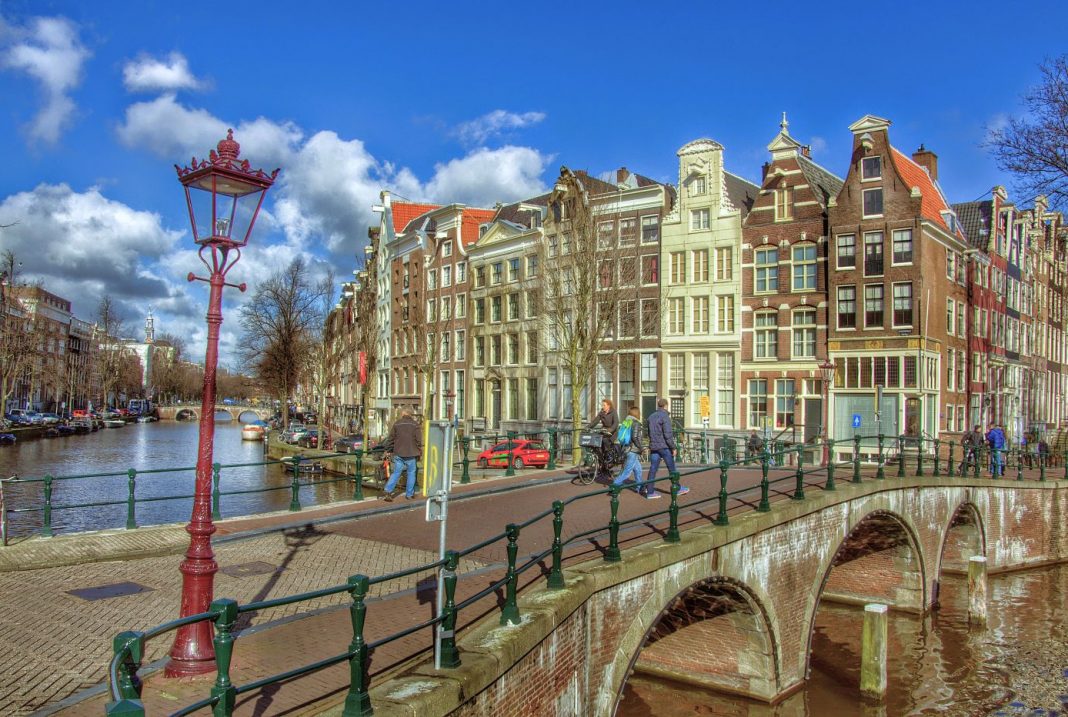 Amsterdam to further tighten tourism rules to restore balance in city